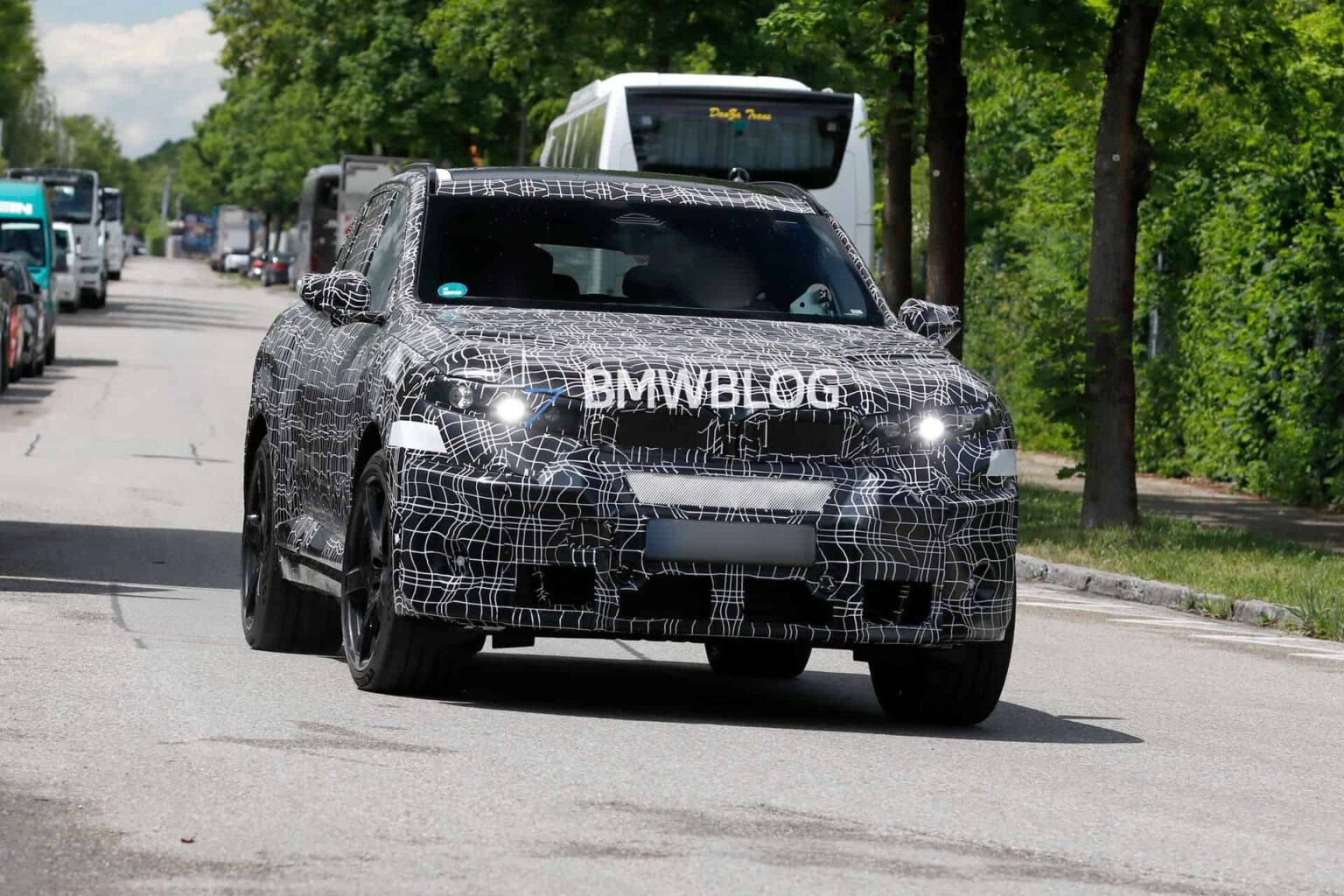 BMW's 900-HP Electric X5 M Spotted Ready for Battle | Wheel Front